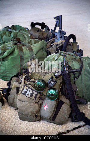 FBI SWAT (Special Weapons and Tactics) team member dons specialized ...