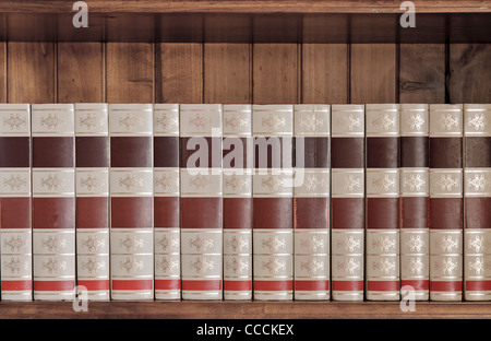 Collection of leather bound books on shelves Stock Photo - Alamy