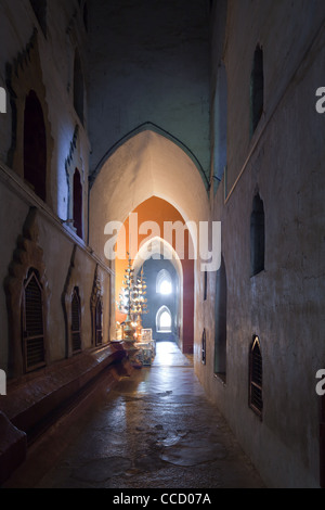 Interior of Ananda temple with corridors and lighting holes. Bagan ...