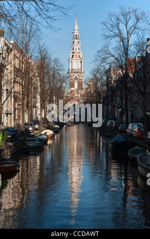The elaborate tower and spire of the 17c Zuiderkerk church reflected in ...