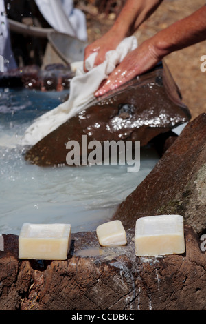 Washing clothes the old fashioned way women demonstrate how their ...