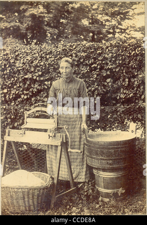 Victorian woman washing laundry with an antique washboard Stock Photo ...