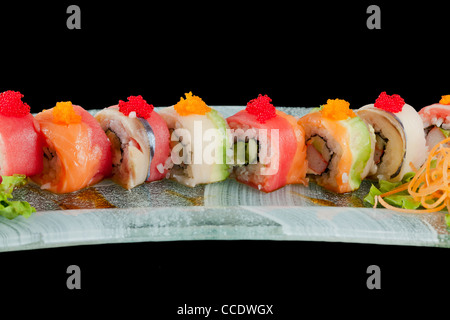 Sushibar Plate Isolated On Black Studio Shot Stock Photo - Alamy