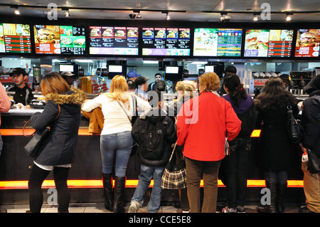 People waiting in line at Macdonald's fast food restaurant, New York ...