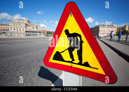 Road sign Warning Road works. In the Red Triangle a man with shovel ...