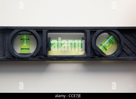 Bricklayers with a spirit level and plumb line Stock Photo - Alamy