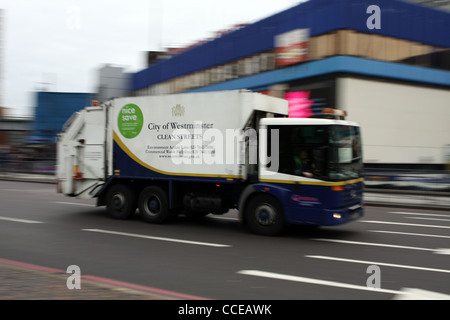 a refuse collection vehicle traveling in London Stock Photo - Alamy