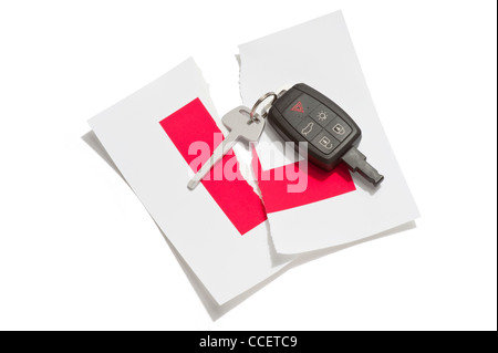 A torn L plate and a car key with a remote key fob Stock Photo - Alamy