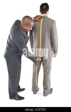 A tailor fitting a man with a suit Stock Photo - Alamy
