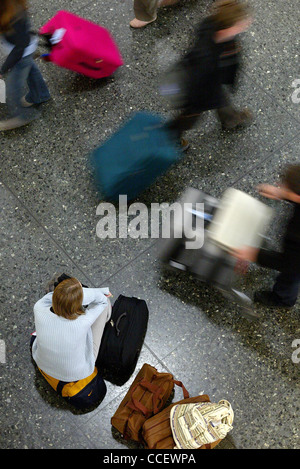 Gatwick Airport, South Terminal, check-in area. Shows passengers ...