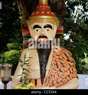 Goofy buck toothed Buddha in Wat Buppharam in George Town in Penang ...