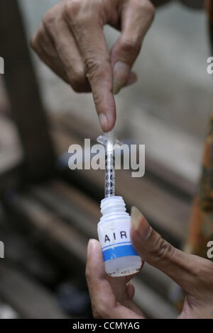 heroin in a hypodermic needle after being cooked on a spoon Stock Photo ...