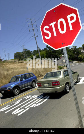 4 way Four way stop sign at intersection, residential neighborhood ...