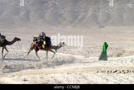 Sep 12, 2004; Kabul, AFGHANISTAN; A camel caravan crosses the desert in ...