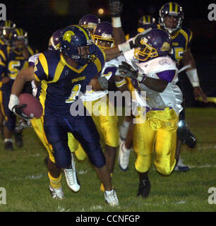 Alex Harbison of the Pinole Valley High cuts through the middle of the ...
