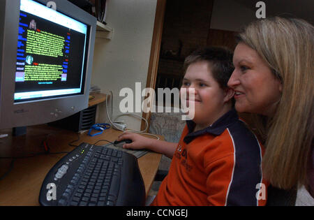 Brent Mutchler 12, and his mother, Laura Mutchler pose for a photo at ...