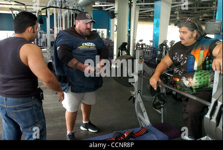Art Ramsey (center), a power lifter, works out with (l to r) Bobby ...