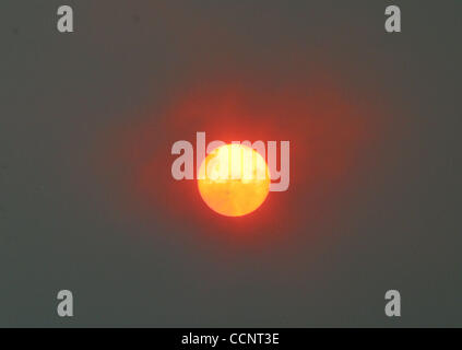 Oct 28, 2003; Santa Clarita, CA, USA; Firefighters in a backyard watch ...