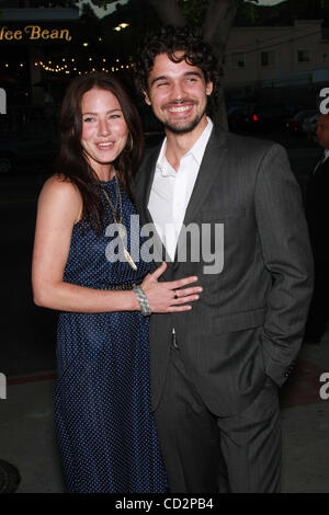 Actor Steven Strait and his wife Lynn Collins pose ahead of the World ...