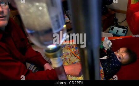 Tom Kimlinger monitored an IV as he administered medicine to boost his ...