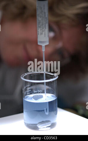 Water quality specialist Sara Sipes examines water samples at the South ...