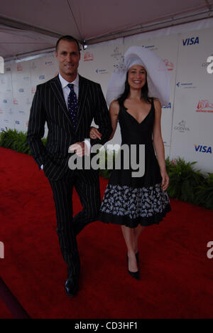 Fashion photographer Nigel Barker and his wife, Christen Chin, walk ...