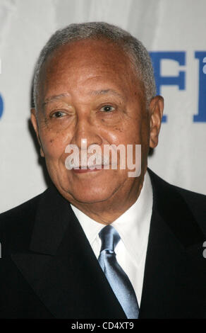 New York City Mayor David Dinkins, with bullhorn, appeals to an angry ...