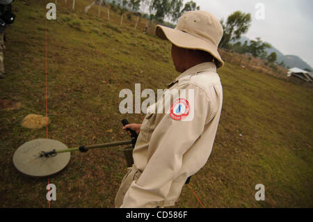 UXO Laos bomb disposal personnel using an Ebinger UPEX 740M metal ...