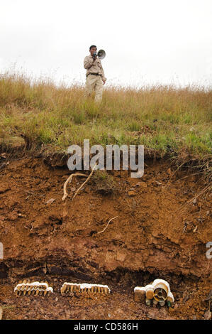 UXO Laos bomb disposal personnel using an Ebinger UPEX 740M metal ...