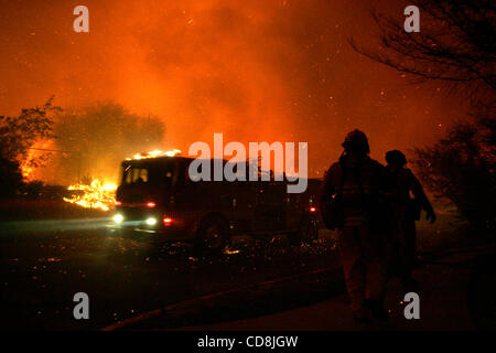 Nov 15, 2008 - Los Angeles, California, USA - A firefighter walks ...