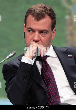 Russian President Dmitry Medvedev (C) attends a wreath laying ceremony ...