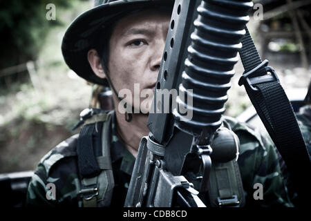 Democratic Karen Buddhist Army (DKBA) attend a ceremony to mark the ...