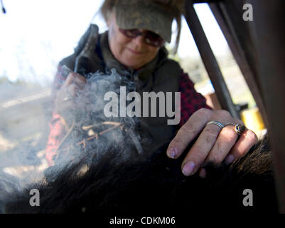 Mar. 22, 2011 - Glide, Oregon, U.S - Smoke rises as BARBARA HATFIELD ...