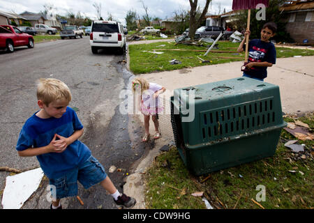 Dominic Blanchette and Kendal Jones of Joplin, Missouri try to help in ...