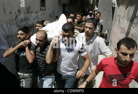 A relative of Palestinian Hisham Abu Harb mourns during his funeral in ...