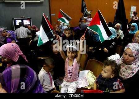 Palestinian supporters of Popular Resistance Committees step on an ...