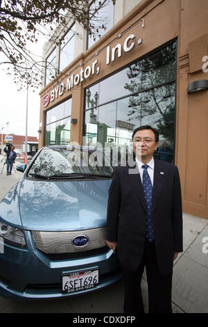 Wang Chuanfu, chairman of BYD, poses next a BYD S6 at the Beijing Auto ...