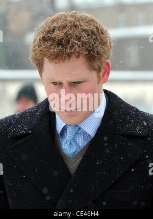 Prince Harry walks through the snow as he visits the Bernauer Strasse ...