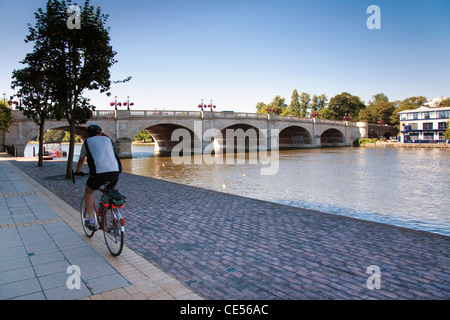Cycling along the tow path of the River Thames at Ham House, Richmond ...