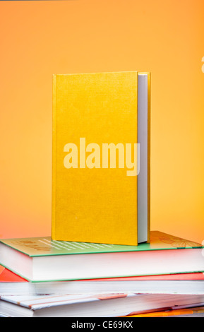 Yellow blank book in upright position Stock Photo - Alamy