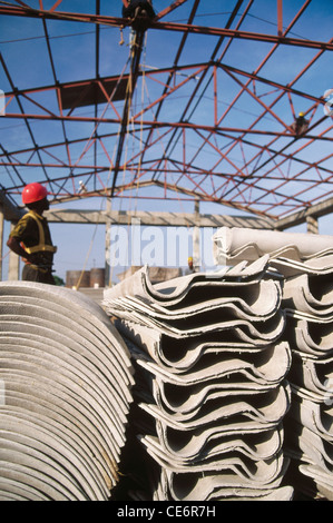 Cement sheets for roofing at construction site, india Stock Photo - Alamy