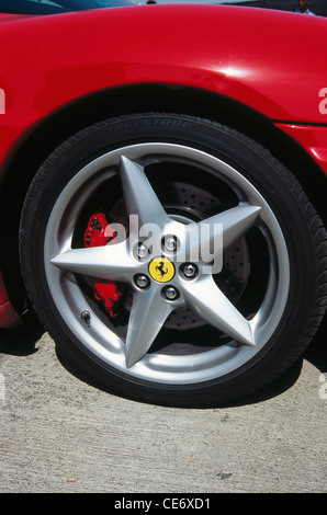 Wheel of red Ferrari car, india Stock Photo - Alamy