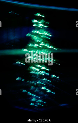 christmas tree and abstract blurred lights on background. Blue, purple ...