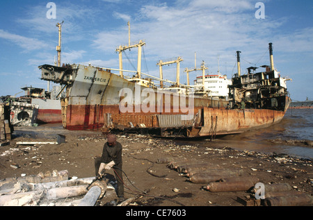 Indian man gas cutting steel plate in Alang ship breaking yard Gujarat India Asia Stock Photo ...