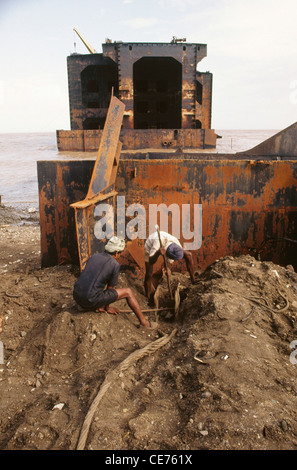 Indian workers working at Alang ship breaking yard ; Alang ; Bhavnagar ; Gujarat ; India ; Asia ...