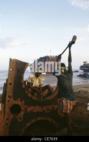Indian workers working at Alang ship breaking yard ; Alang ; Bhavnagar ; Gujarat ; India ; Asia ...