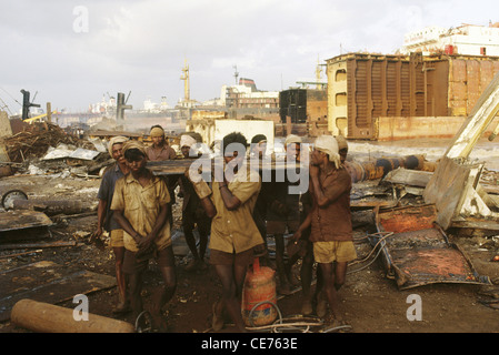 Indian workers working at Alang ship breaking yard ; Alang ; Bhavnagar ; Gujarat ; India ; Asia ...