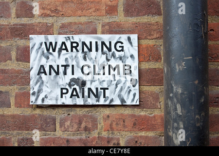 Warning anti vandal paint sign on wall to prevent vandals vandalism on ...