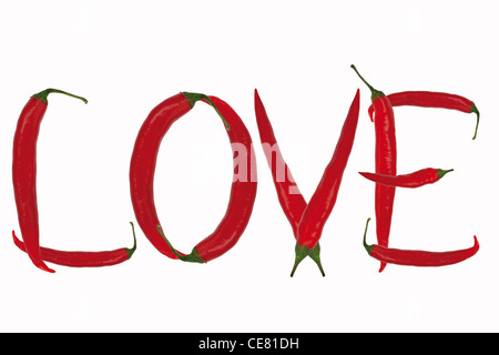 Red paprika with a red inscription on a white table Stock Photo - Alamy