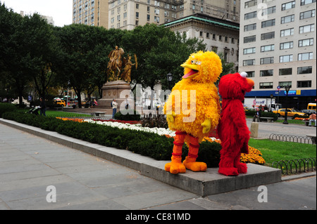 Two Sesame Street cartoon characters entertainers (Big Bird Elmo ...